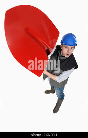 Mason raising spade in the air Stock Photo - Alamy
