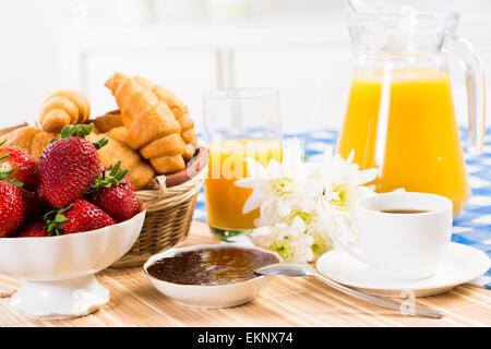 Early breakfast. Strawberries, cream and juice. The symbol of healthy ...