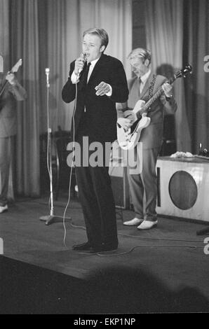 British pop singer Mike Sarne performing on stage at the Pop Prom at ...