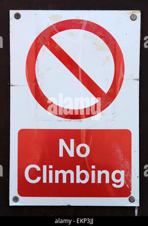 No climbing red and white warning sign on a black background with ...