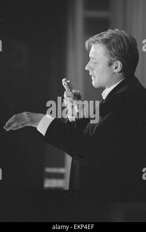 British pop singer Mike Sarne performing on stage at the Pop Prom at ...