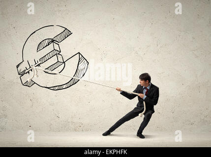 Image of young businessman pulling euro sign rope with Stock Photo - Alamy