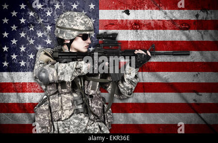 soldier holding rifle on a american flag background Stock Photo - Alamy
