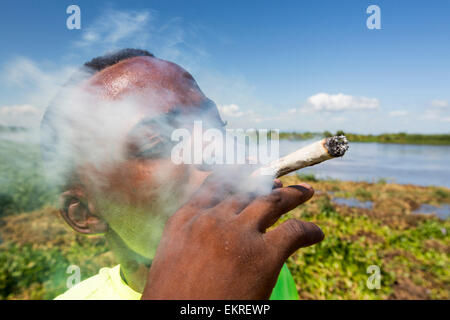 Teenager smoking a spliff Stock Photo - Alamy