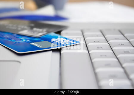 A Group off credit cards and bank cards on a Computer laptop keyboard ...