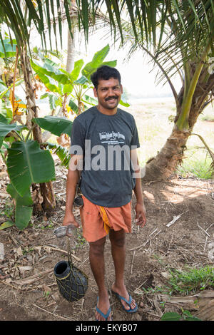 An Indian man demonstrates how to make Palm Wine (toddy) as part of a ...