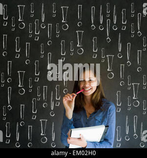 Businesswoman student teacher chalk exclamation marks Stock Photo - Alamy