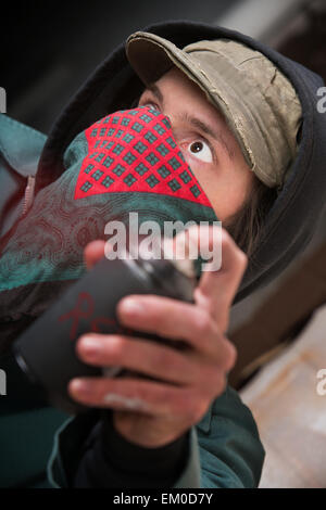 Scared Gangster with Spray Paint Stock Photo - Alamy