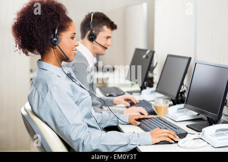 customer service agents working in office Stock Photo - Alamy
