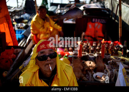 Jiaxing, China. 15th Apr, 2015. Local people attends traditional water ...