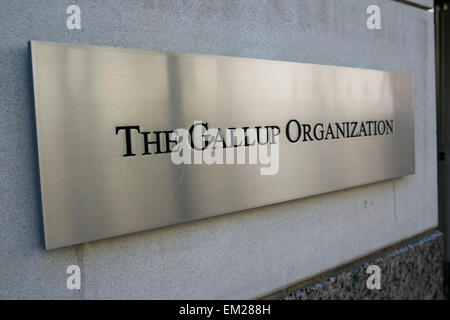 A sign on the exterior of the headquarters of the polling firm, The ...