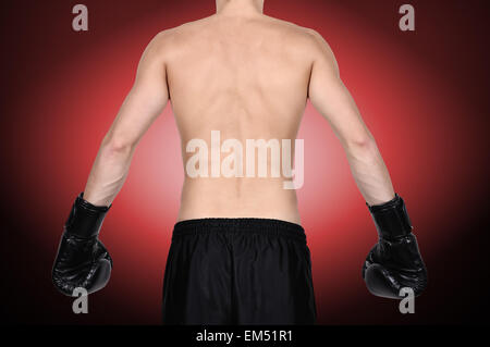 boxer standing with his back under the spotlight Stock Photo - Alamy