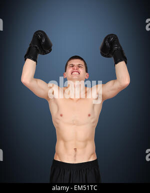 happy boxer winner on a blue background Stock Photo - Alamy