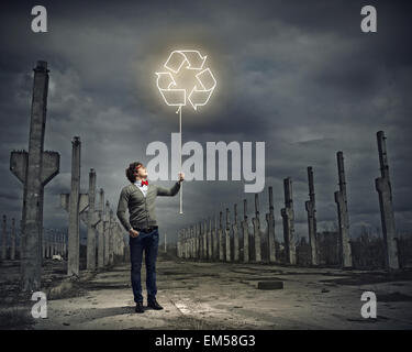 Young man with a recycle symbol Stock Photo - Alamy