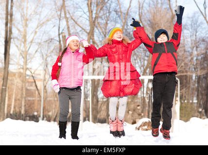 Children in Winter Park fooled in the snow Stock Photo - Alamy