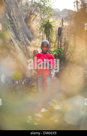 Three African children pose for the camera during the Christmas ...