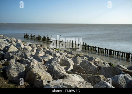 Wooden groynes & rock armour protecting the coastline from erosion at ...