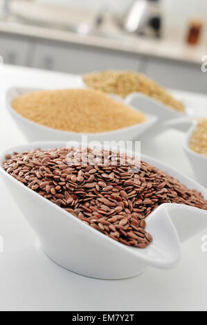 Bowl of brown flax seeds on wooden table Stock Photo - Alamy