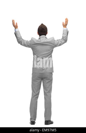 Full length of successful businessman raising his arms Stock Photo - Alamy