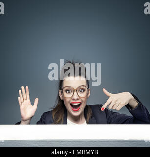Pretty young business woman with glasses and holding binder on white ...