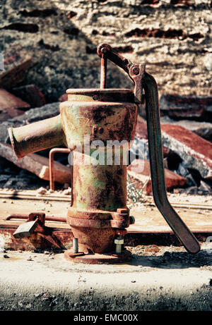 Old and rusty manual water pump Stock Photo - Alamy
