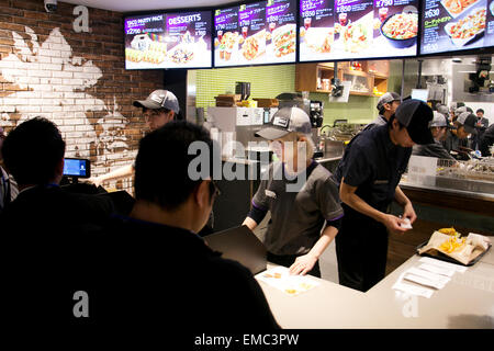 Staff of the new Taco Bell branch start to work during the pre-opening ...