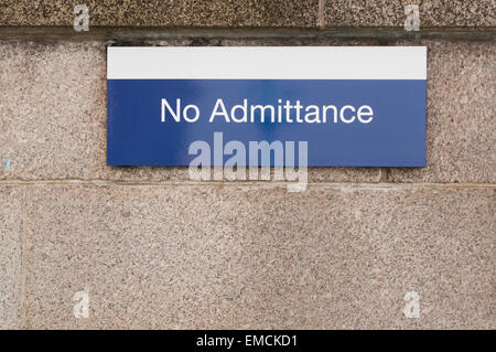 No admission sign mounted on a concrete wall Stock Photo - Alamy