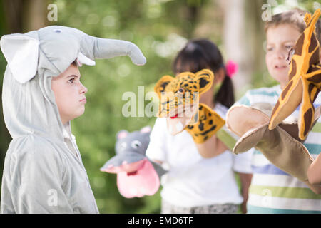 Kids playing wild animal dress-up Stock Photo - Alamy