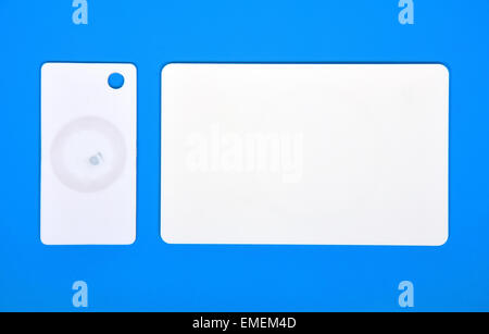 two white RFID cards on a blue background Stock Photo - Alamy