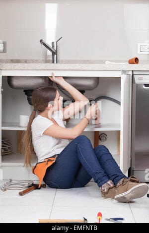 two plumbers working Stock Photo - Alamy