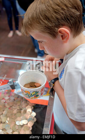 Coin pusher gambling machine Stock Photo - Alamy