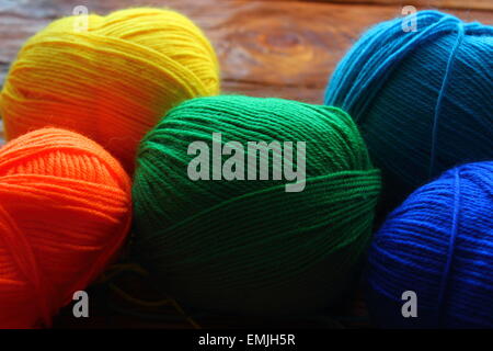 on a wooden board lie arm rests for knitting Stock Photo - Alamy