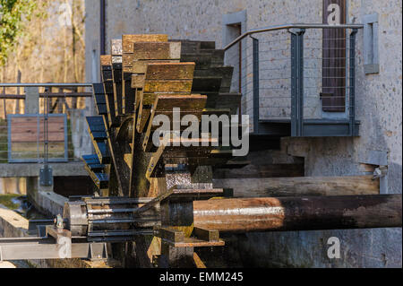 Series of three wheeled wooden mill renovated Stock Photo - Alamy