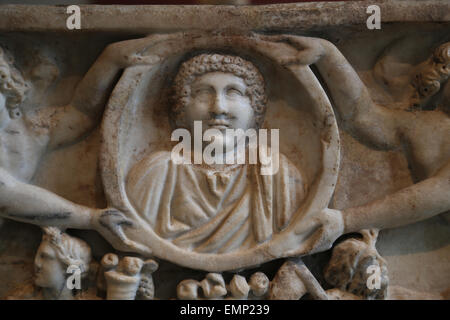 Roman Art. Marble sarcophagus with flying erotes holding a clipeus ...