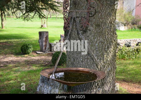 An imaginative water basin made of iron objects Stock Photo - Alamy