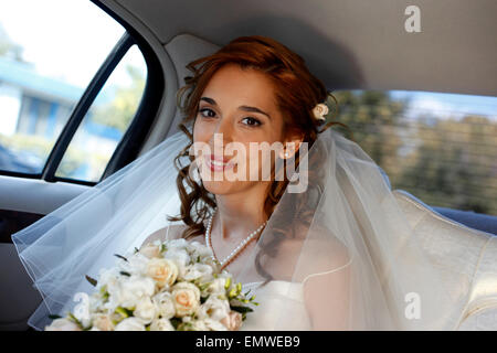 The beautiful bride in the automobile Stock Photo - Alamy