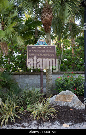 Entrance of the Naples Pier with tropical flowers in the summer in ...