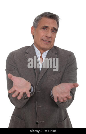 Senior businessman asking why Stock Photo - Alamy