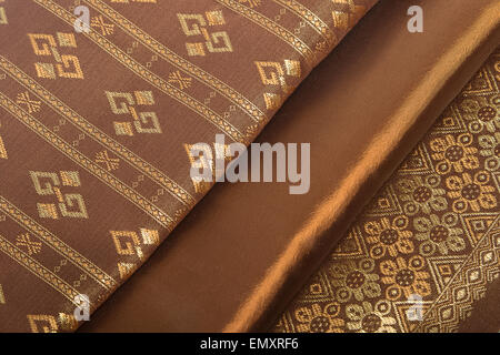 Traditional brown Thai fabric pattern as background Stock Photo - Alamy