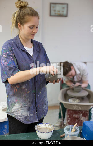 Women participating in a pottery class, art class, making ceramics ...
