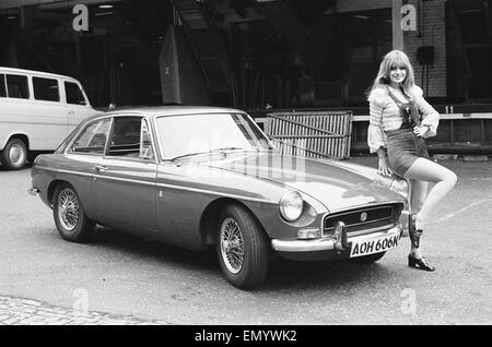 Reveille model Emma Vincent seen here posing with a MGB GT which is top ...