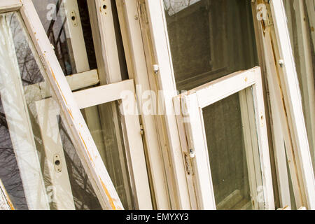 Unwanted window frames with white wood and intact glass Stock Photo - Alamy
