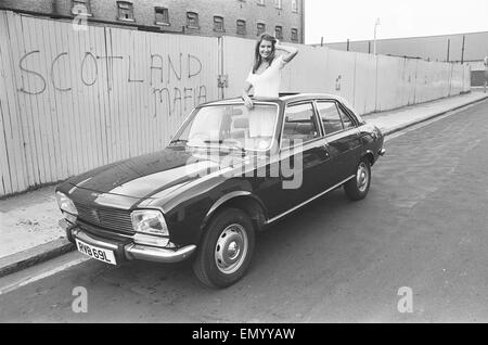 Reveille model Beulah Hughes seen here posing with a Lancia car which ...