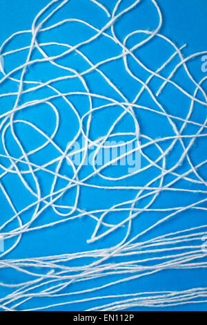 Abstract white wool strings on blue background with copy space Stock ...