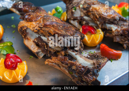 Closeup showing leg of lamb on display at a hotel restaurant buffet ...