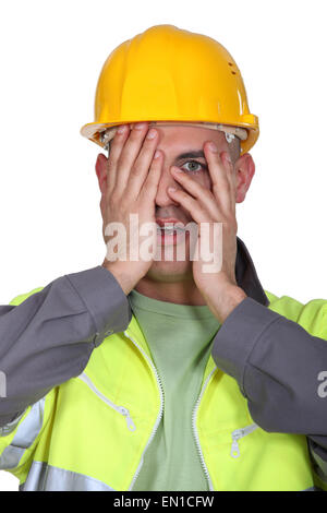 Construction worker hiding his face with hands Stock Photo - Alamy