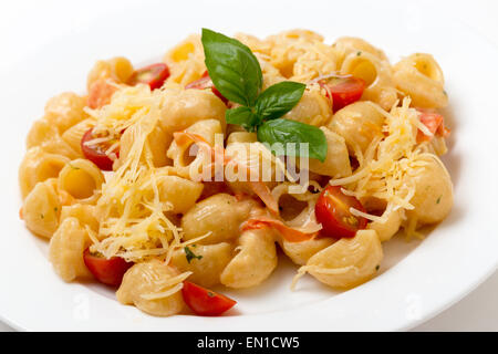 Gomiti rigata "elbow" pasta tossed with tomatoes cooked in cream with ...