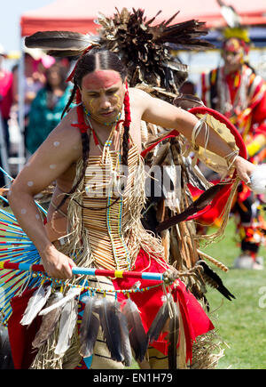 Native American pow wow dancer dancing in crouched position in full ...