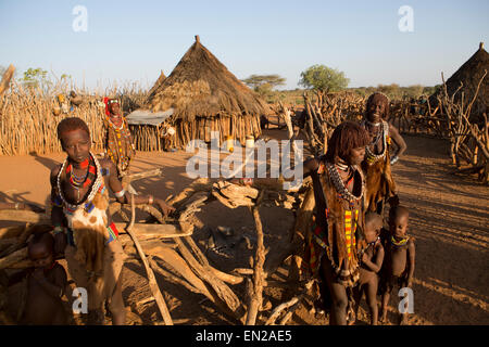 Hamer tribe family portrait in front of their hut in Turmi, Lower Omo ...