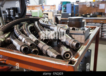 hydraulic hoses on the table in the workshop Stock Photo - Alamy